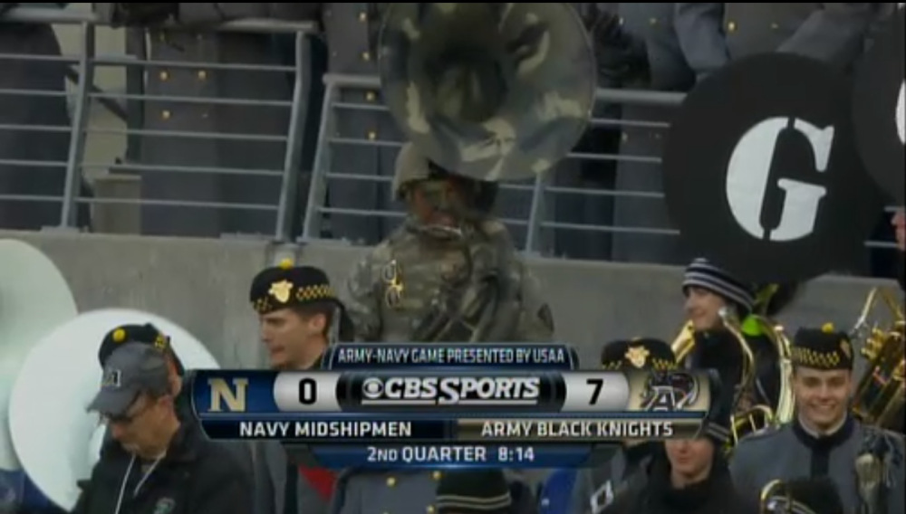 Army band conductor wears ghillie suit during Navy game | wusa9.com